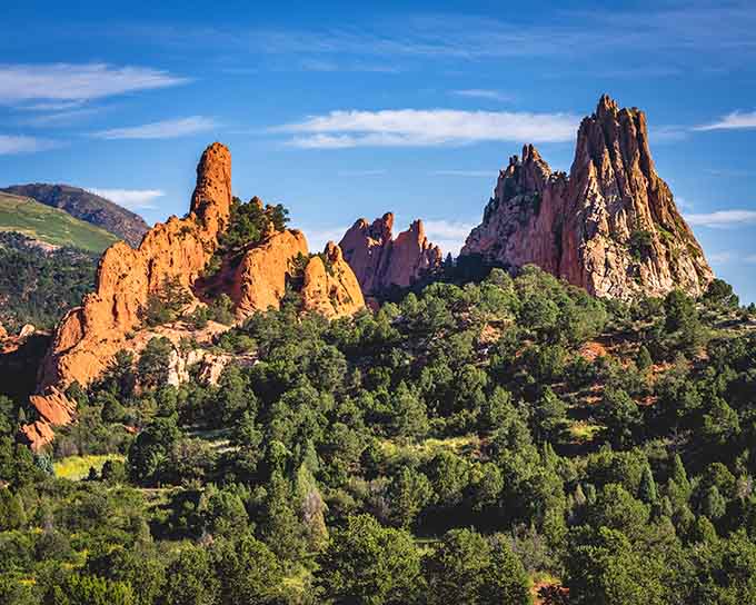 These towering formations glow amber in afternoon light, their weathered faces telling stories older than your favorite classic movies.