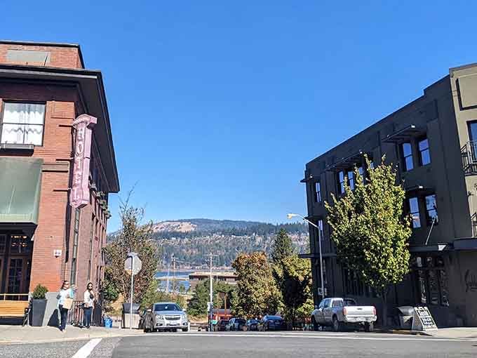 Between those buildings, you'll catch glimpses of the Columbia River sparkling like liquid silver.
