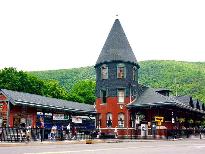 That distinctive tower stands guard like a Victorian-era lighthouse guiding visitors to small-town charm and character.