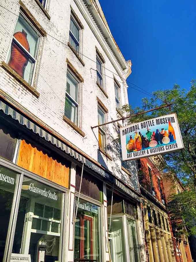 Sunlight catches the historic facade where thousands of vintage bottles wait to share their stories with curious visitors.