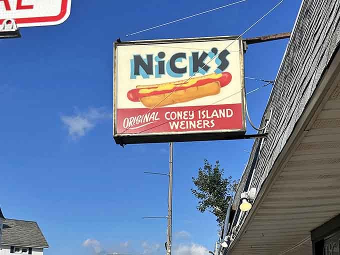 Against a perfect blue sky, this vintage sign promises Original Coney Island Weiners that deliver pure nostalgia.
