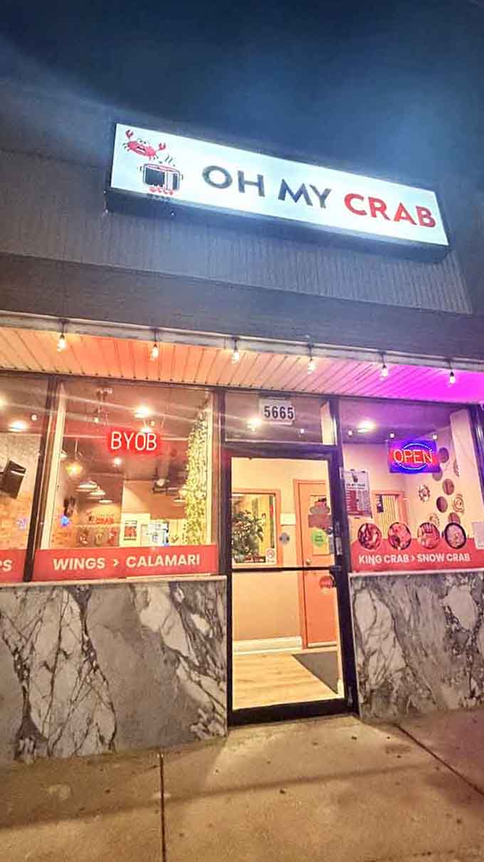 That glowing sign at dusk promises Cajun-spiced adventures and buttery indulgence, like Mardi Gras for your taste buds.