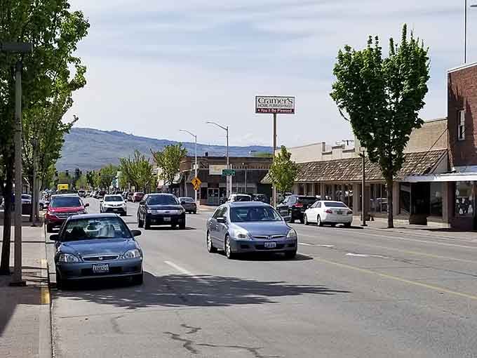 Mountains frame the main drag where everyday life unfolds beneath peaks that never get old, no matter how often you see them.