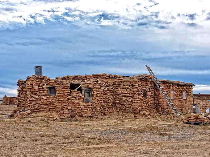 Weathered sandstone walls reveal construction techniques passed down through countless generations of skilled Hopi builders.