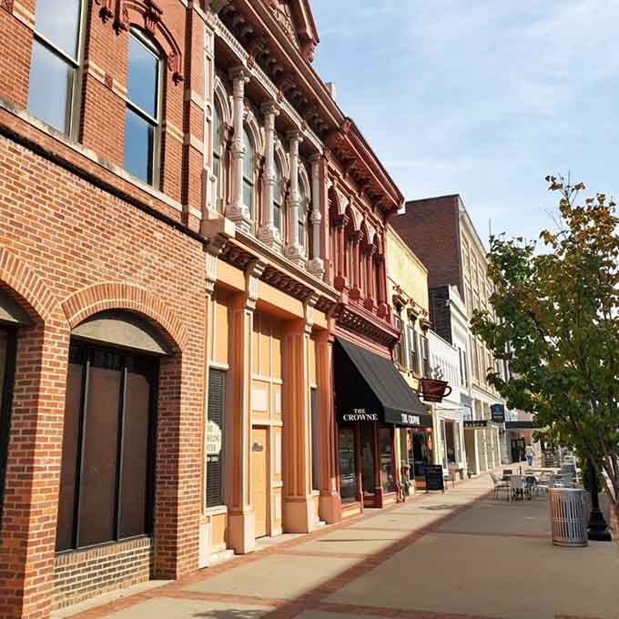 Afternoon light bathes these storefronts in golden warmth that makes window shopping feel downright therapeutic and delightful.