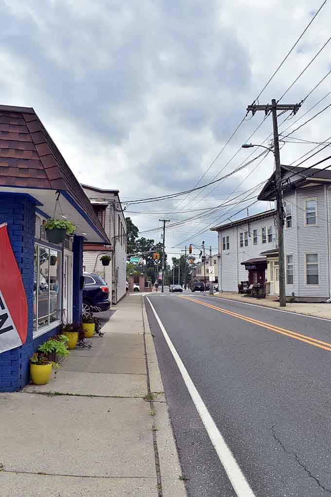 Colorful storefronts and hanging flower baskets bring cheerful energy to these quiet residential streets every season.