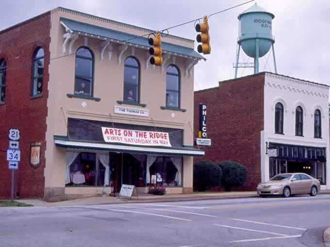 That water tower stands proud like a lighthouse guiding antique hunters to their promised land of treasures.