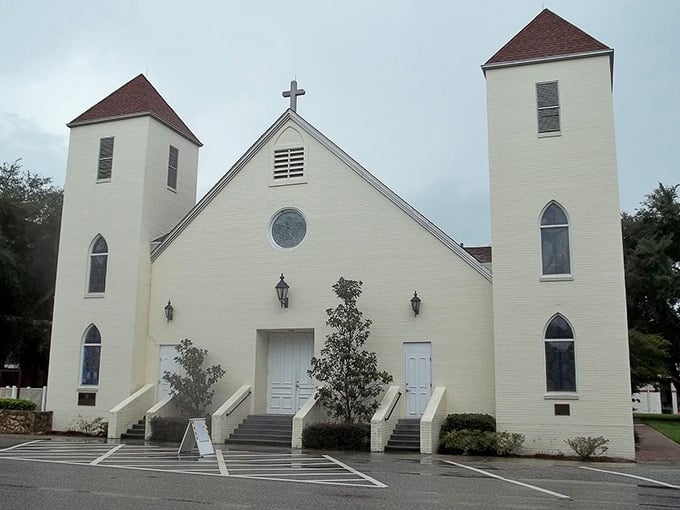 Twin towers rise gracefully above this historic church, standing as a beacon of community faith and architectural beauty.
