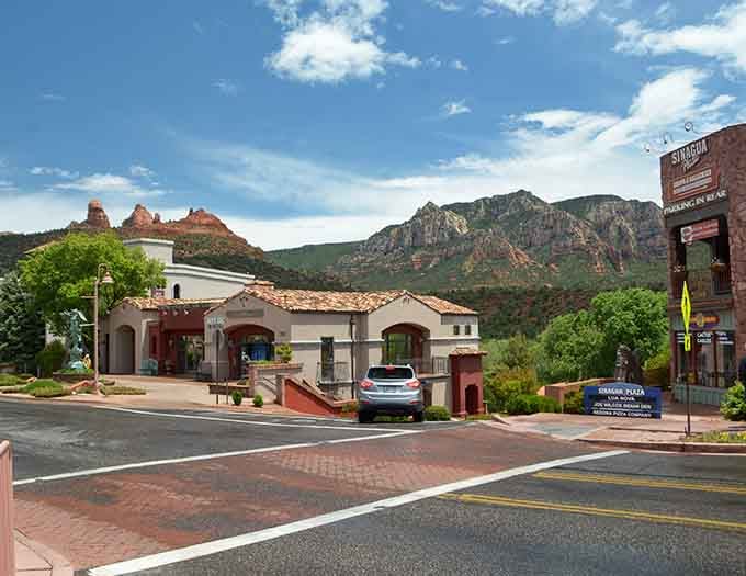 Spanish-style architecture frames the famous rocks perfectly, creating a scene that belongs on every Arizona postcard ever made.