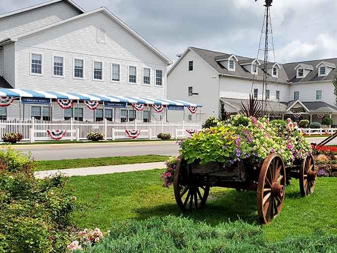 Patriotic bunting decorates this charming scene where old-fashioned wagons overflow with flowers that would make Martha Stewart jealous.