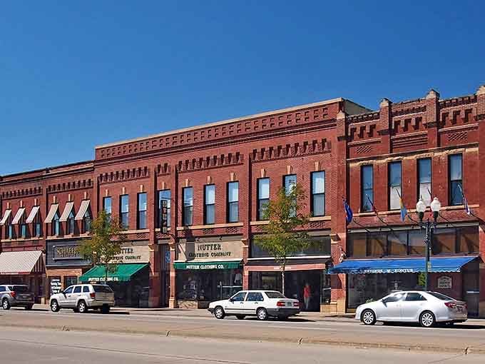 Detailed brickwork and colorful awnings create a downtown that feels like stepping into a beloved memory.