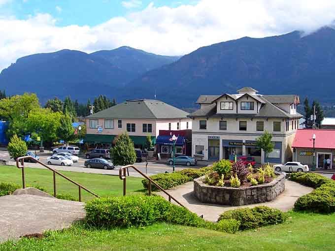 Manicured gardens meet mountain majesty where small-town charm feels like stepping into a postcard come alive.