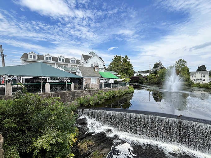 The fountain dances while diners gather, creating a symphony of water and conversation that's purely magical.