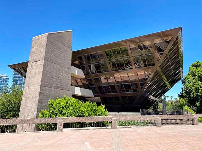 The inverted design creates shade below while the glass and concrete structure defies gravity like a 1970s fever dream.