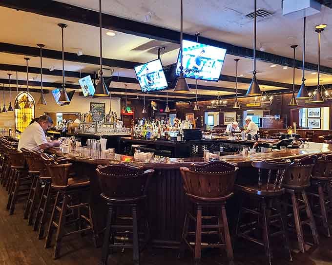 The spacious bar with pendant lighting and comfortable seating creates the perfect spot to unwind before tackling a magnificent steak dinner.