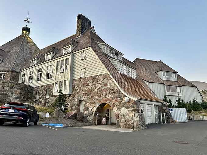 Stone and timber come together at this historic lodge entrance, welcoming visitors like an old friend.