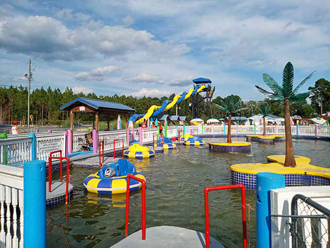 Colorful play structures pop against the sky, turning shallow water into a playground of endless possibilities.