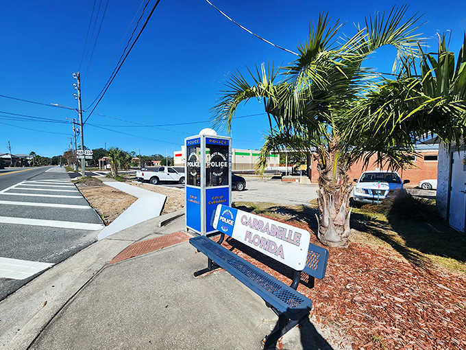 That blue police booth sitting roadside with its bench is like something from a small-town sitcom episode.