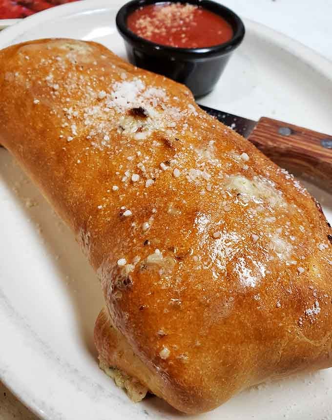 Golden, crispy, and generously stuffed, this stromboli could make a grown person weep with joy.