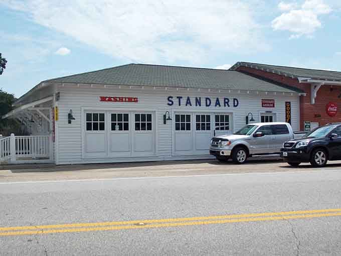 The old Standard Oil station stands proud, reminding us when gas stations had actual architectural dignity and character.