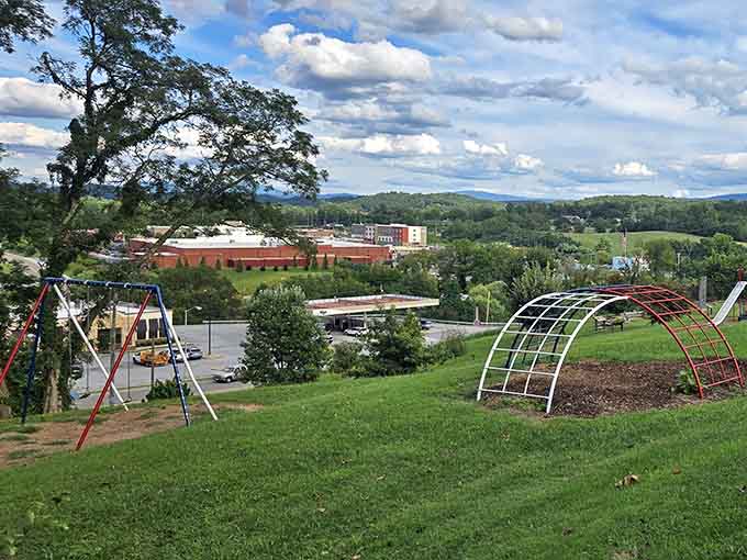 Rolling hills meet playground swings in a view that perfectly captures small-town life at its finest.