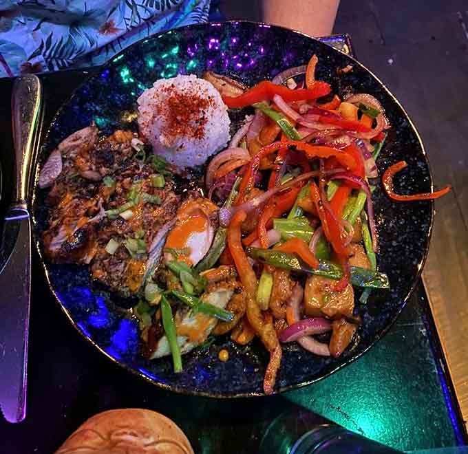 Jerk chicken so vibrant it practically glows, served with vegetables that remember what color means in cooking.