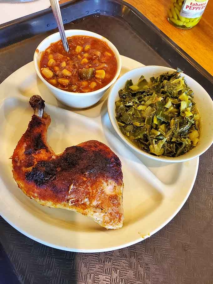 Golden fried chicken with silky collard greens and tender beans, the holy trinity of Southern comfort on one plate.