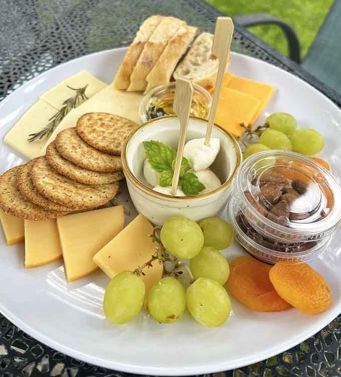 This cheese plate arrangement is so photogenic it deserves its own Instagram account and possibly a modeling contract.