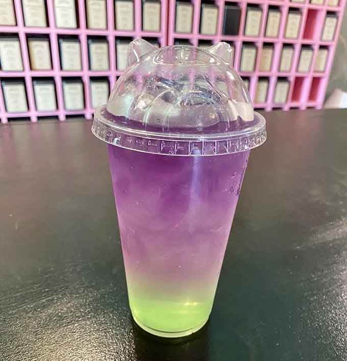 This gradient beauty shifts from purple to green like a drinkable sunset in Wonderland itself.