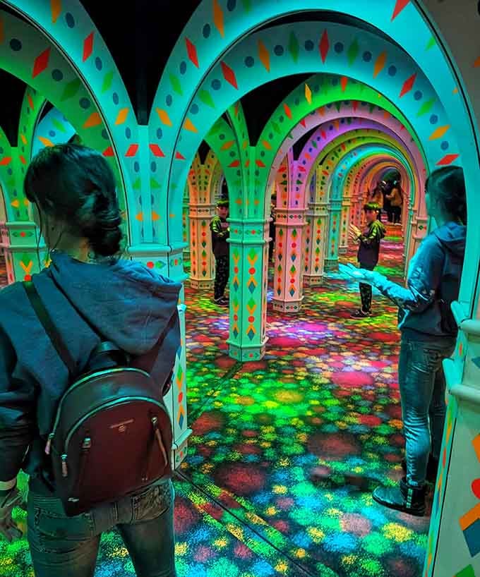 The maze transforms visitors into explorers navigating a kaleidoscope of endless color and light patterns.