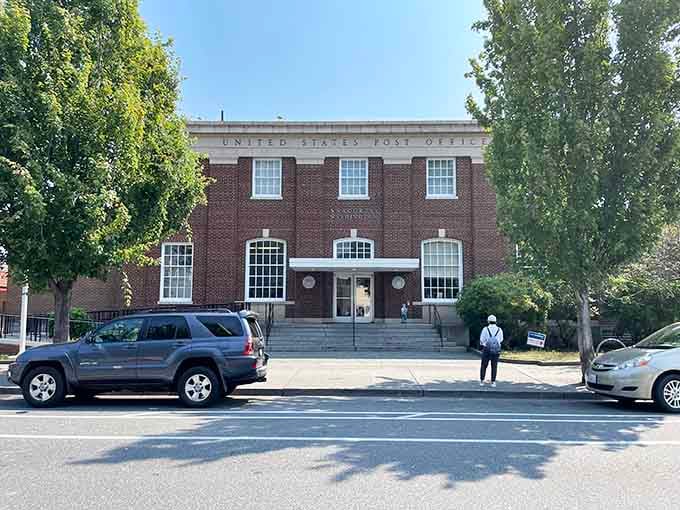 Classic brick postal service building standing proud, back when architecture meant something more than just efficient boxes.