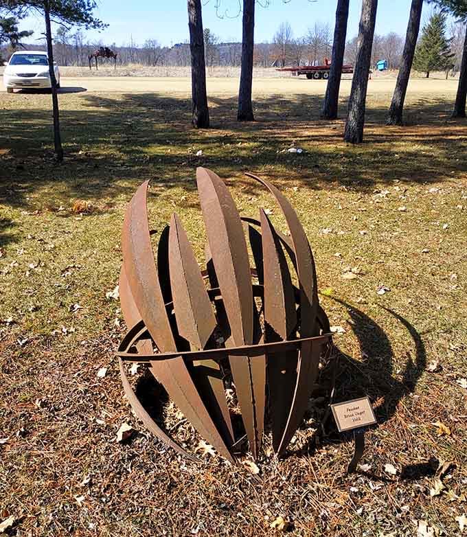 Rusty metal curves create organic forms that look like nature's own abstract doodles come to life.