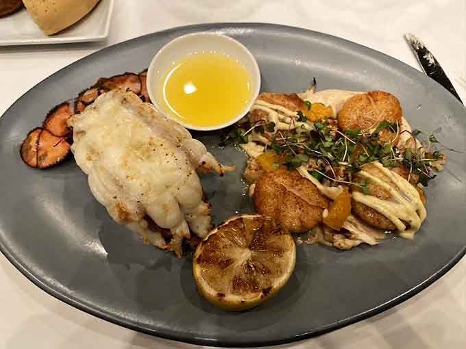 Scallops and lobster tail plated so beautifully you'll hesitate before diving in, but only for a second.
