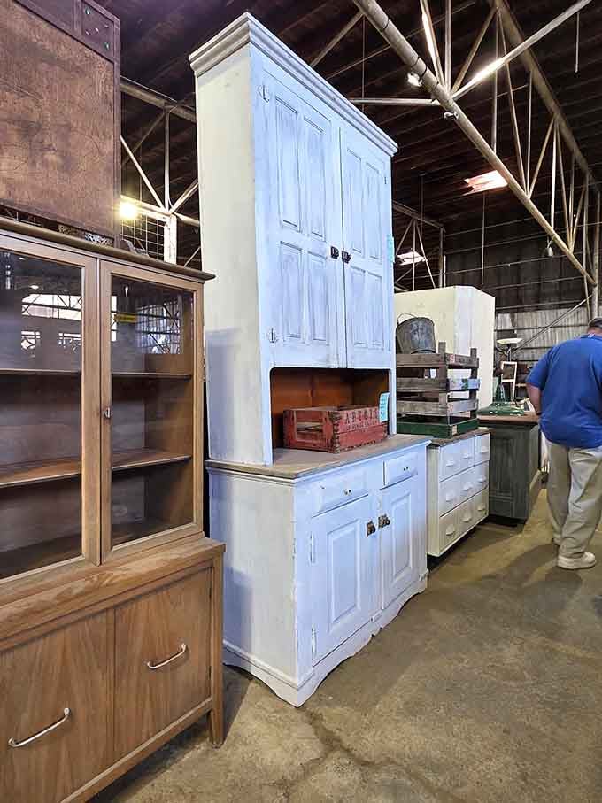 That towering white cabinet is basically the skyscraper of kitchen storage, and yes, you need it.