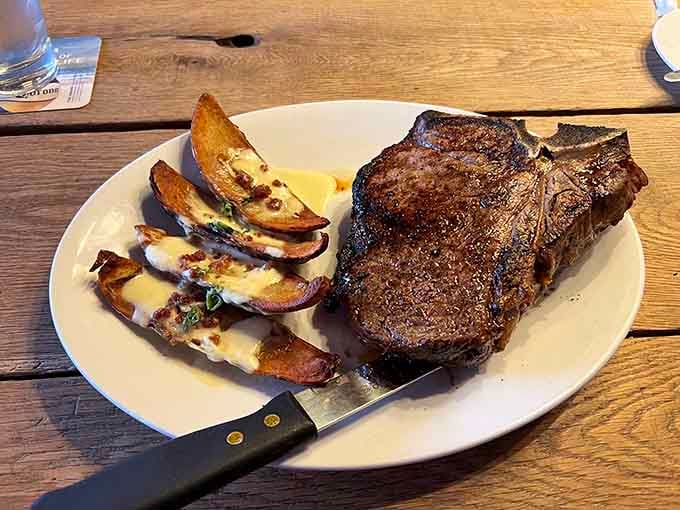 Behold the perfectly seared steak with loaded potato skins, proof that Kansas City knows its way around beef.