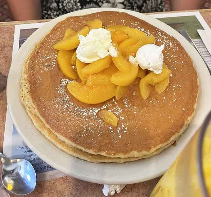 Behold: a pancake so magnificently large it comes with its own gravitational pull and powdered sugar snowfall.