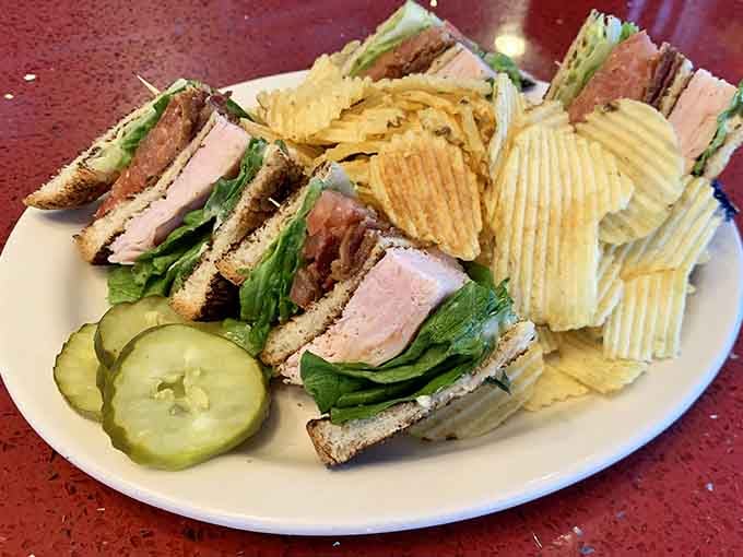 This triple-decker club sandwich comes with chips and a side of pure nostalgia&mdash;no extra charge for memories.
