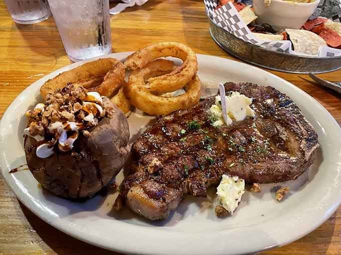 When your steak comes with onion rings that could double as Olympic medals, you know you're in good hands.