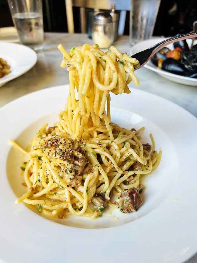 Spaghetti carbonara so perfectly executed, it could make a Roman grandmother weep tears of joy and approval.