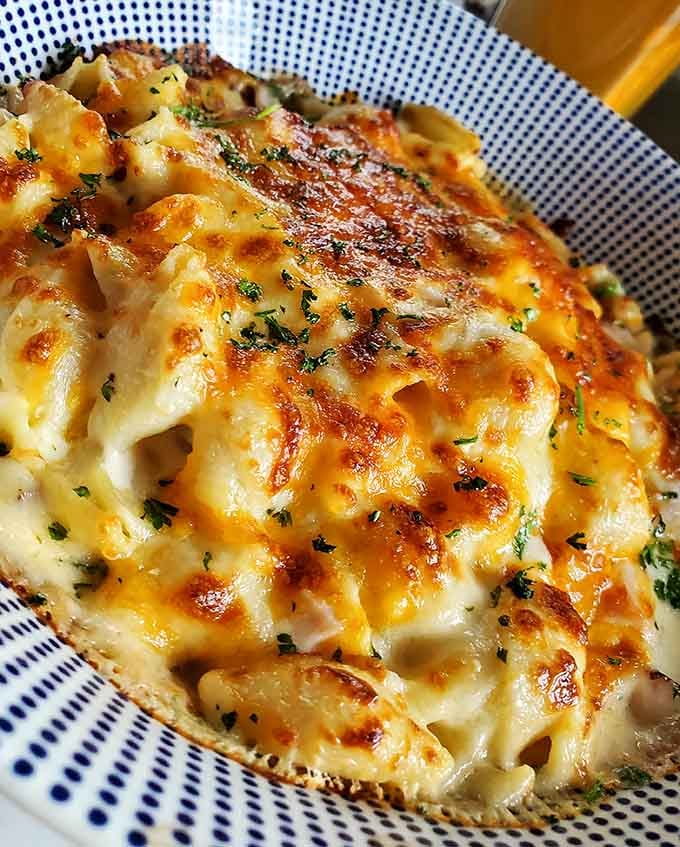 This mac and cheese could make a grown person weep with joy, all golden and bubbling with cheesy perfection.
