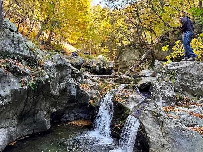Small cascades whisper secrets along the path, building anticipation for the main event ahead.