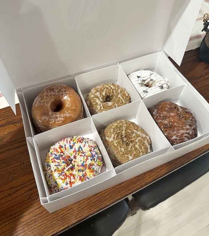 This box contains more joy than most people experience in a week, neatly arranged in sugary perfection.