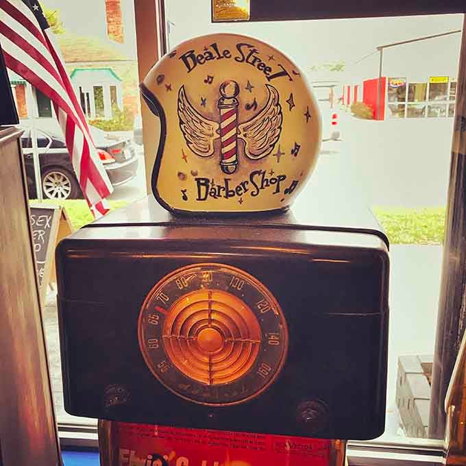 This hand-painted helmet sign captures the spirit of a place where barbering becomes an art form worth celebrating.