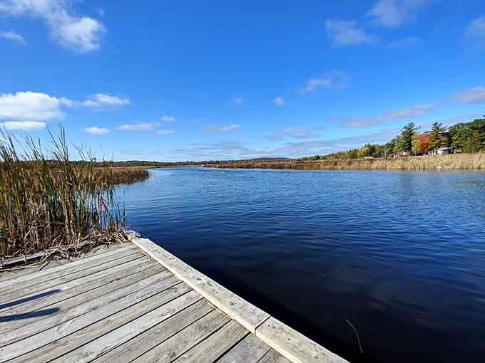 This dock stretches into water so blue you'll question whether your eyes need recalibrating or just appreciation.