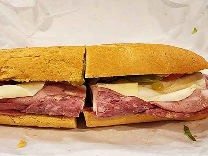 Layers of Italian meats and cheese stacked so generously, this sub could double as architectural inspiration.
