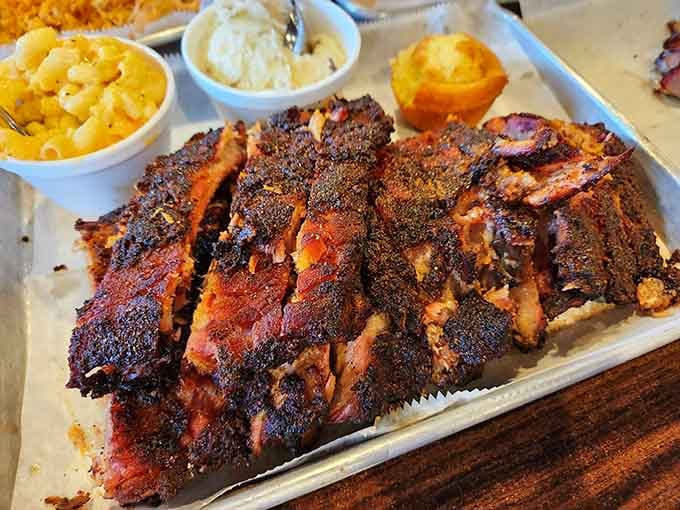 Look at that gorgeous bark and perfect smoke ring, ribs so tender they'd make Fred Flintstone weep with joy.