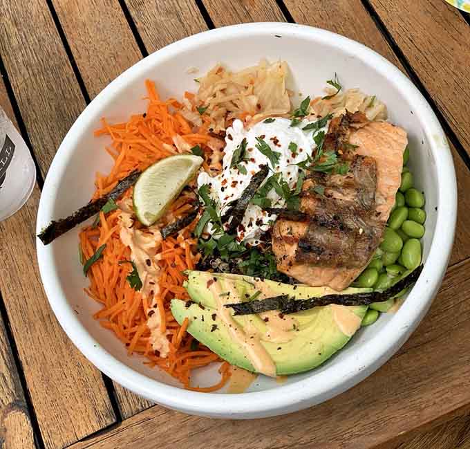 This seared salmon bowl looks like a rainbow decided to take a vacation in your lunch bowl.