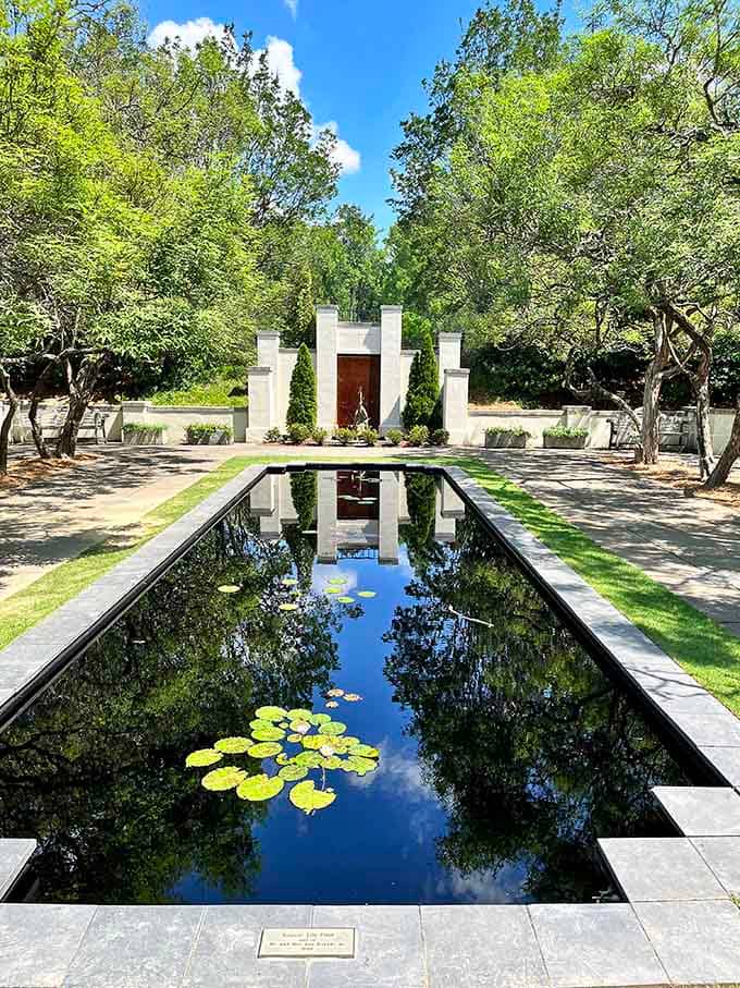 The lily pool's reflection game is so strong, you'll question which way is up in this serene oasis.