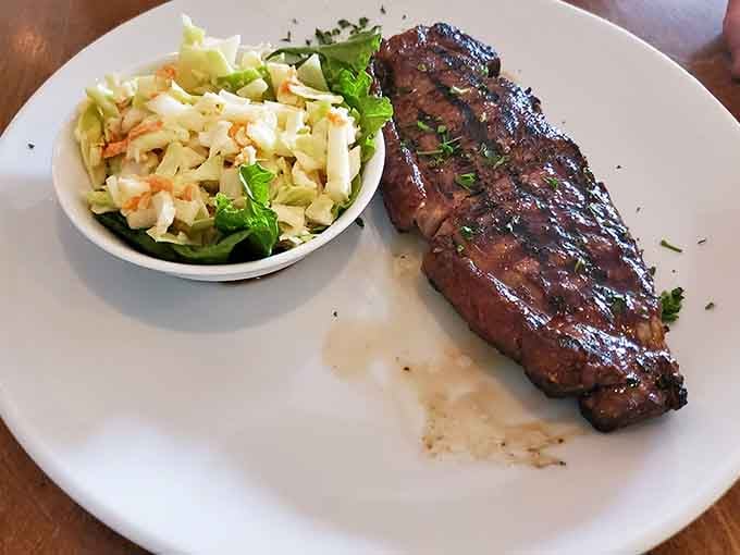 That perfectly charred New York Strip with coleslaw proves simple done right beats complicated done wrong every time.