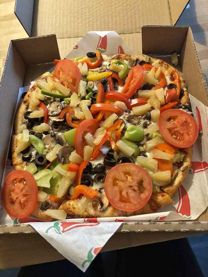 The Vegetarian arrives looking like a garden decided to throw itself a party on top of melted cheese.